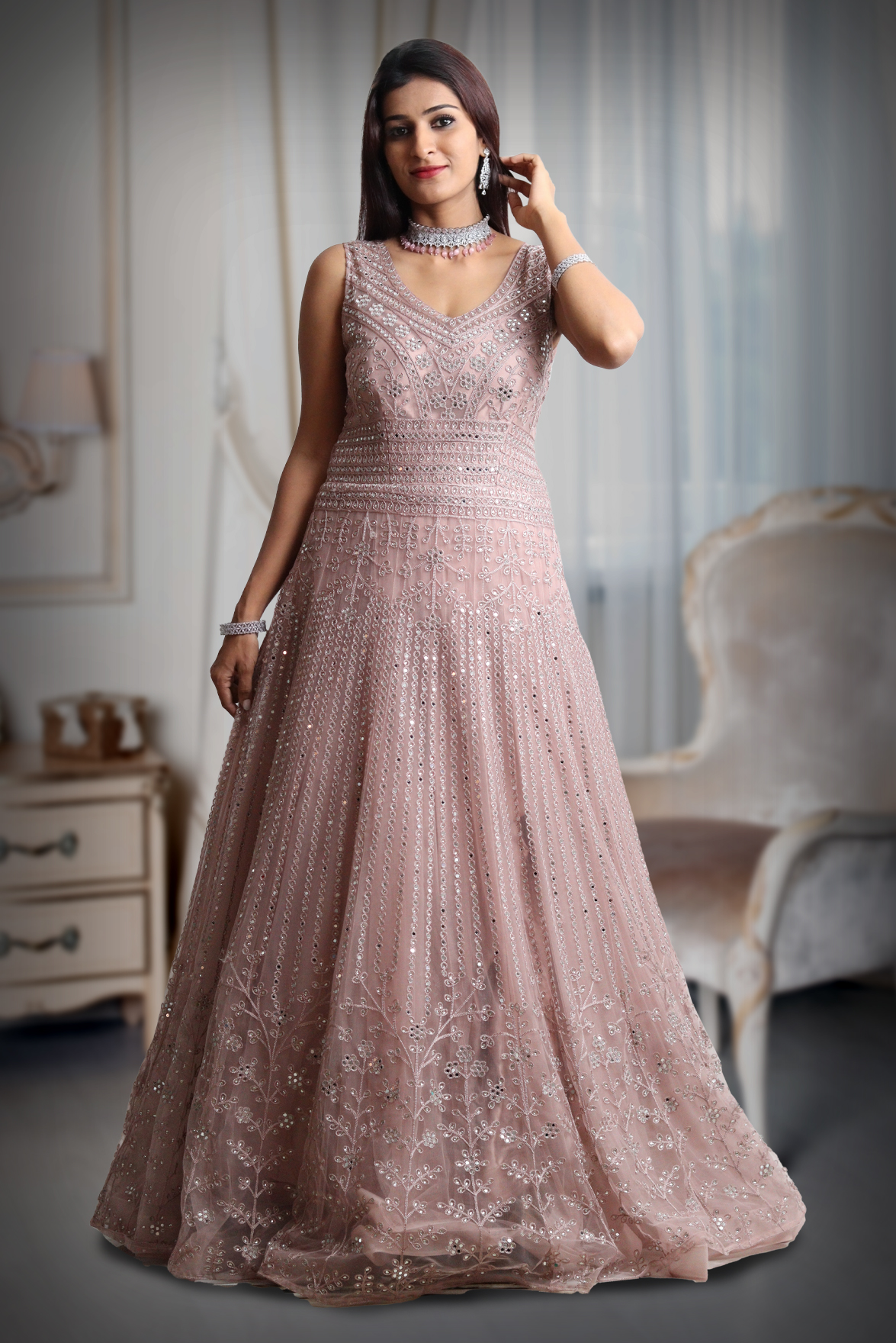 Pastel Peach Sleeveless Gown With Exquisite Stone Work Detailing